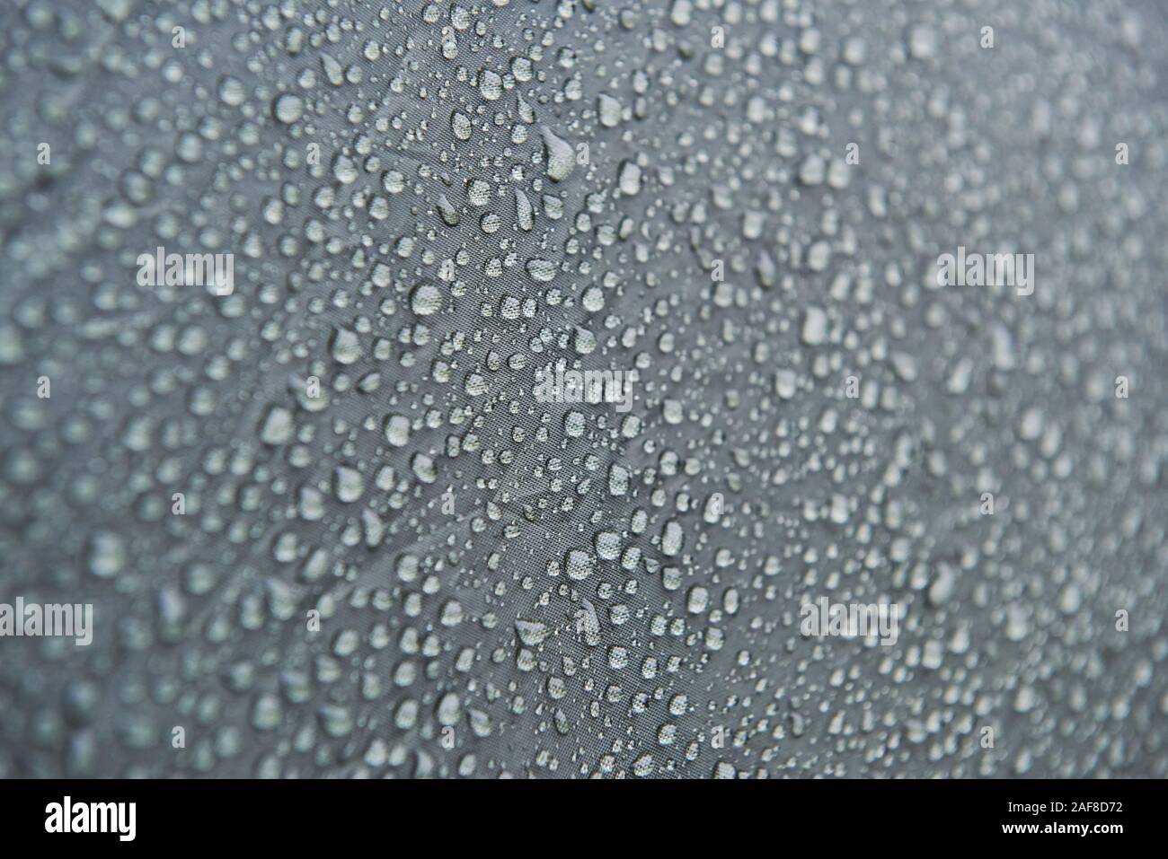 Wet grey surface of touristic tent. Drops of water Stock Photo - Alamy