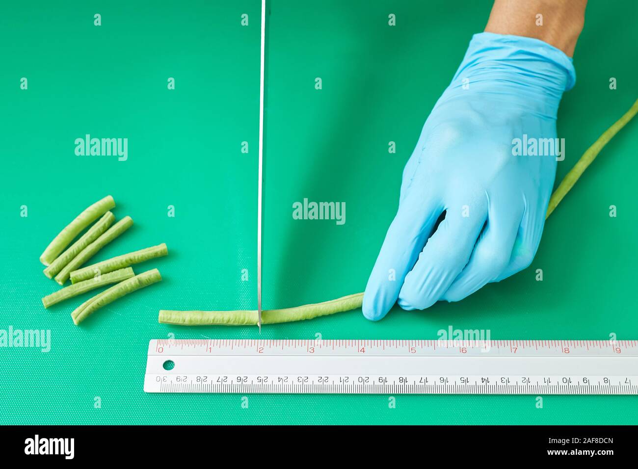 Closeup hand cutting vegetables on cutting board Stock Photo - Alamy