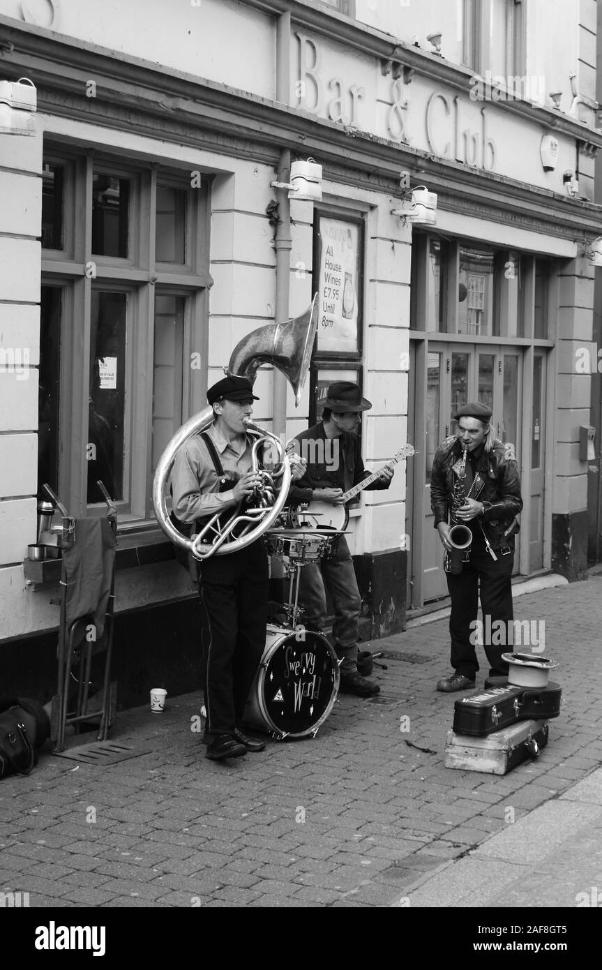 Brass band busker trio Stock Photo - Alamy