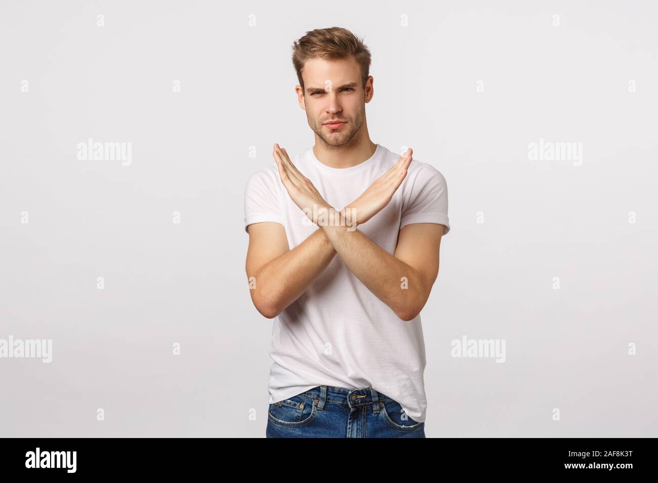 I disagree. Serious-looking blond guy with bristle making cross, stop ...