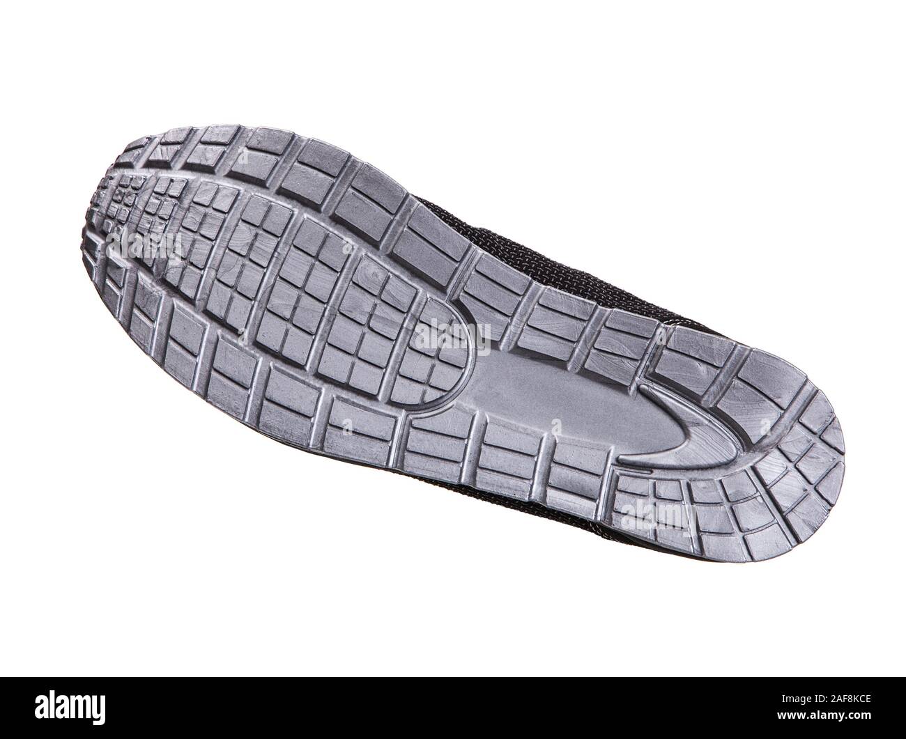 The sole of a modern sneaker is gray. Sports shoes isolate on a white ...