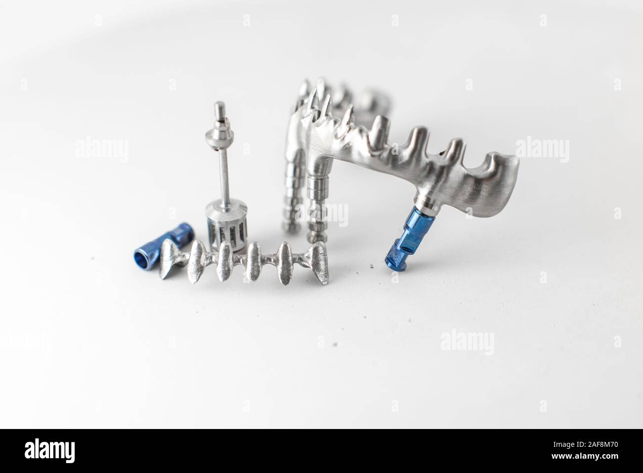 Close-up studio shot on milled metal frame for dental implants on the ...