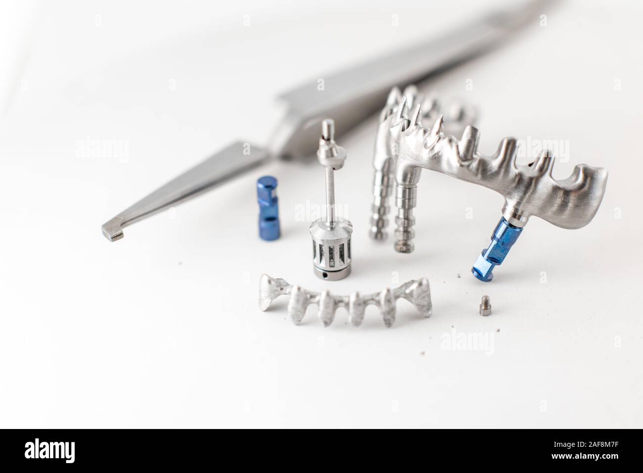 Close-up studio shot on milled metal frame for dental implants on the ...