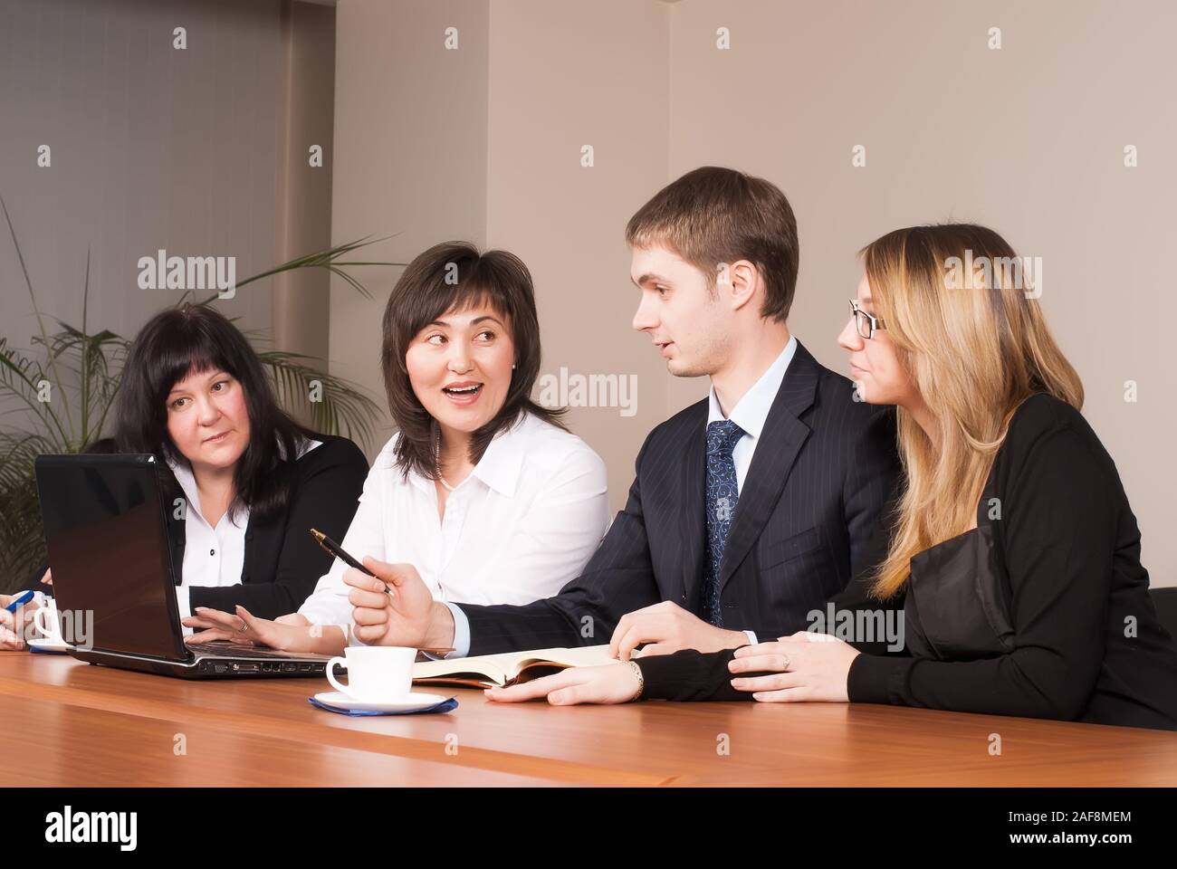 mixed group in business meeting Stock Photo - Alamy