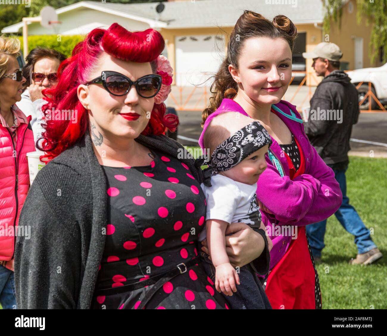 A mother and daughter dressed in 1950's period outfits and sporting ...