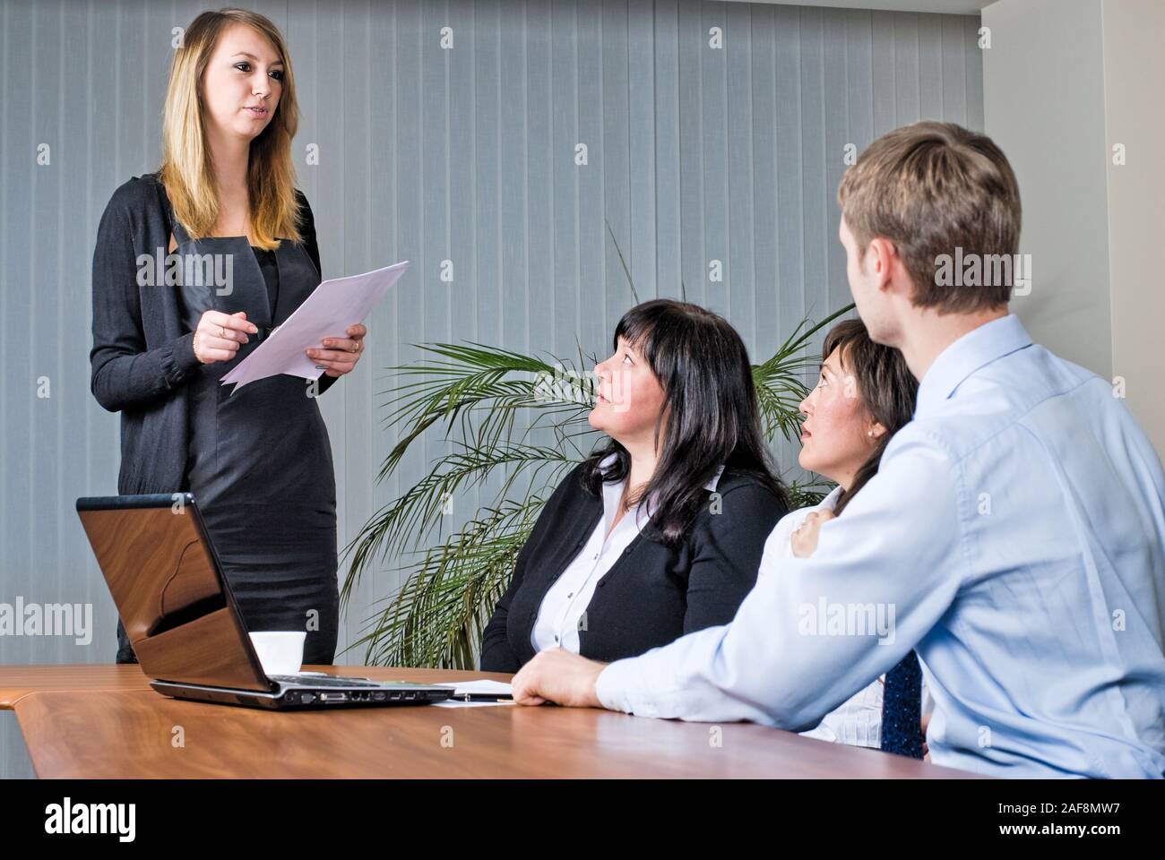 Woman making a business presentation Stock Photo - Alamy