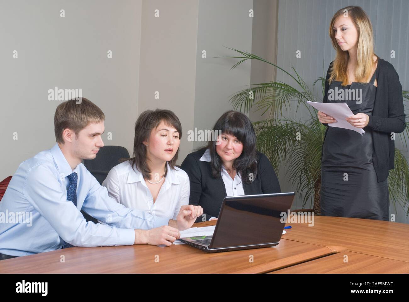 Attractive woman makes business presentation Stock Photo - Alamy