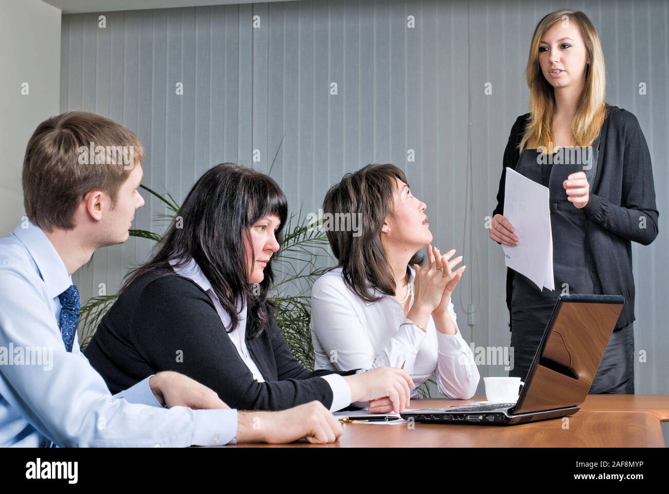 Pretty woman making a business presentation Stock Photo - Alamy