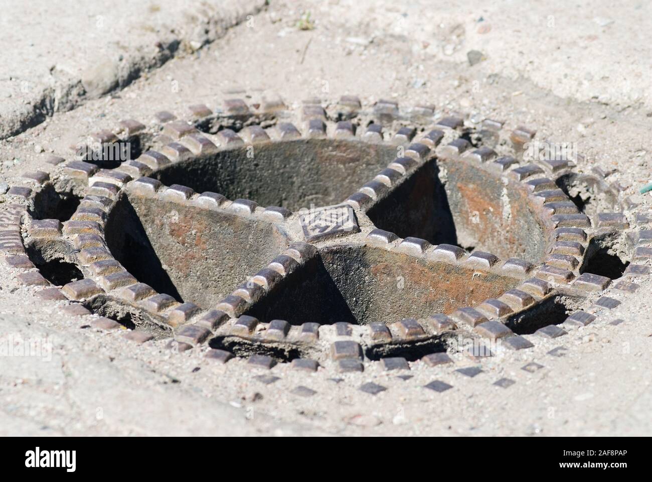 Old manhole in Baltiysk. Russia Stock Photo - Alamy