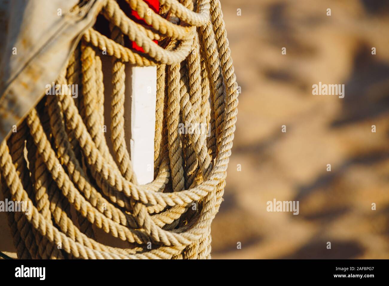 Rope On Boat's Deck. Hanging rope wool close-up on blurred background ...