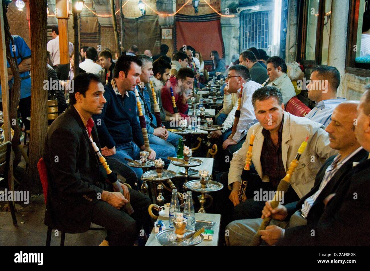 Men smoking nargileh and taking tea at Çorlulu Alipasa Medresesi ...