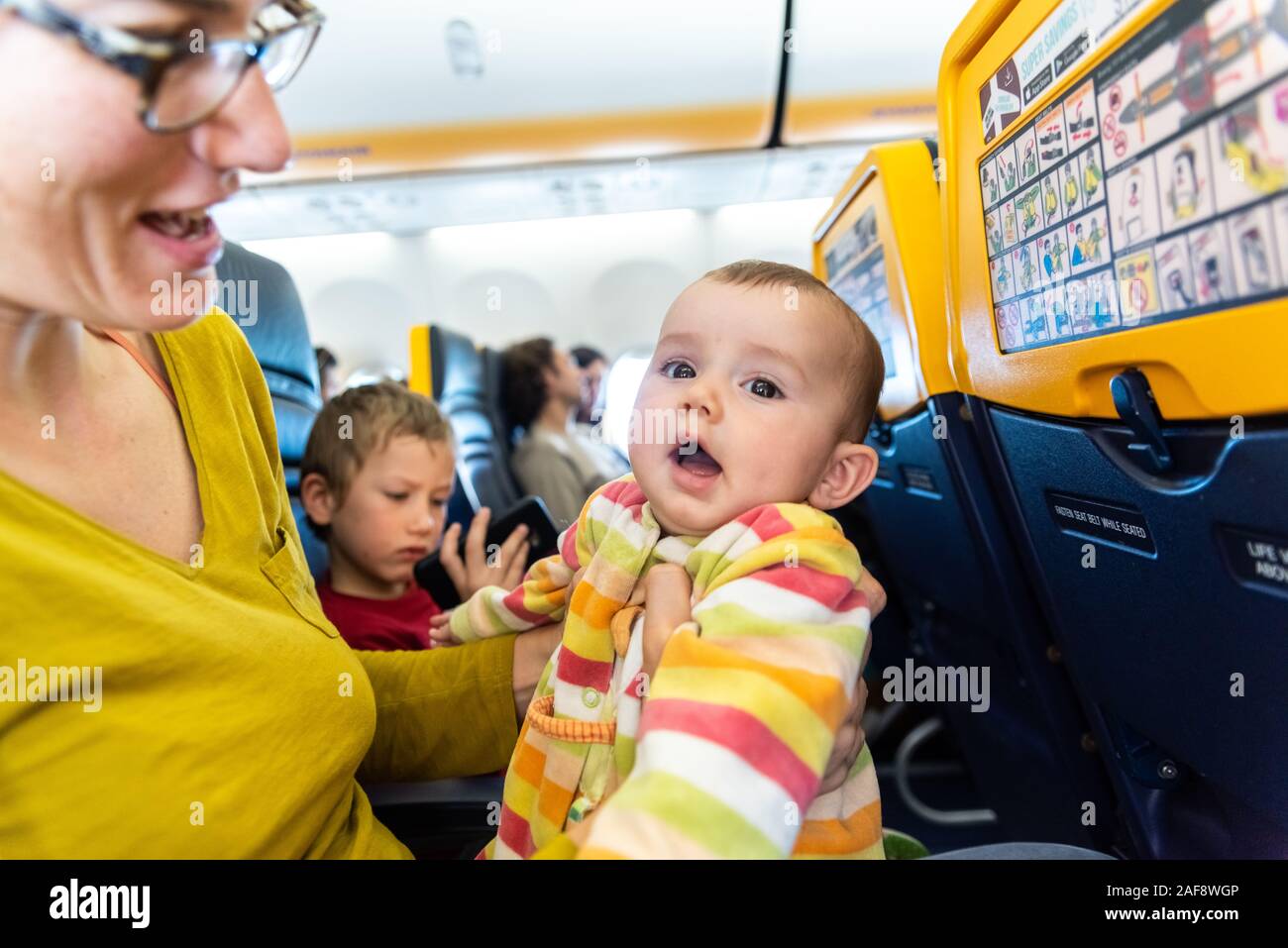 Mother entertaining toddler son hi-res stock photography and images - Alamy