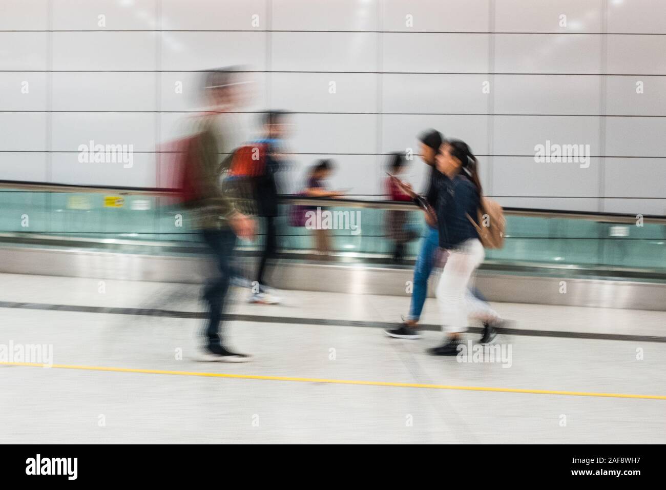 Motion blur of people walking Stock Photo - Alamy