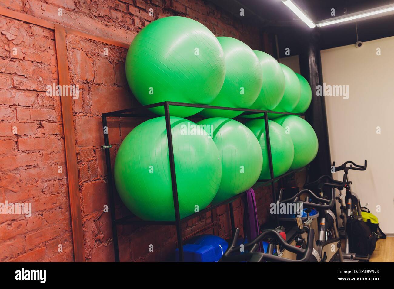 Receding row of weights lined up in a gym waiting for clients with ...