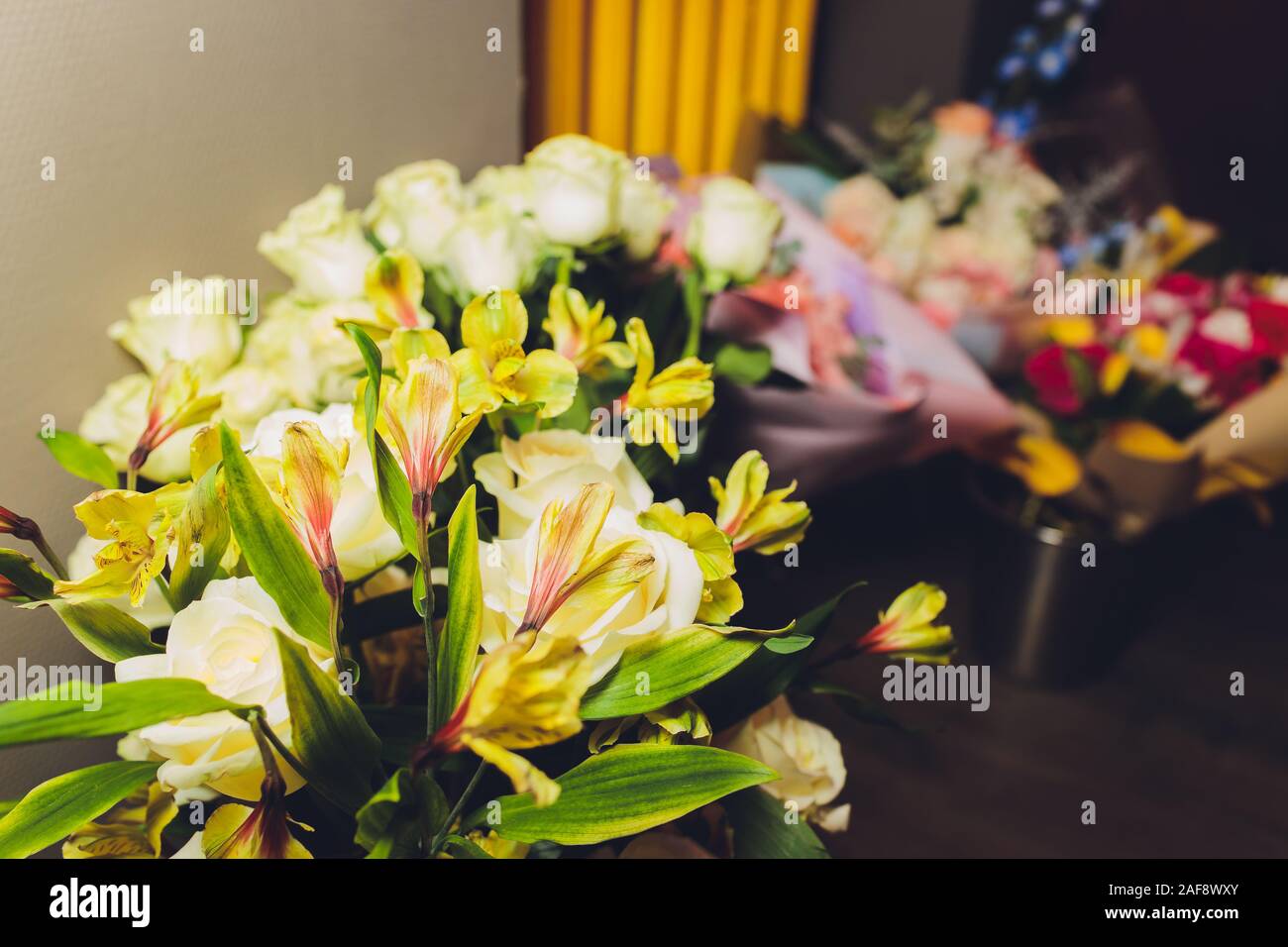 Bouquet of flowers consists of lilies and forget me nots Stock Photo ...