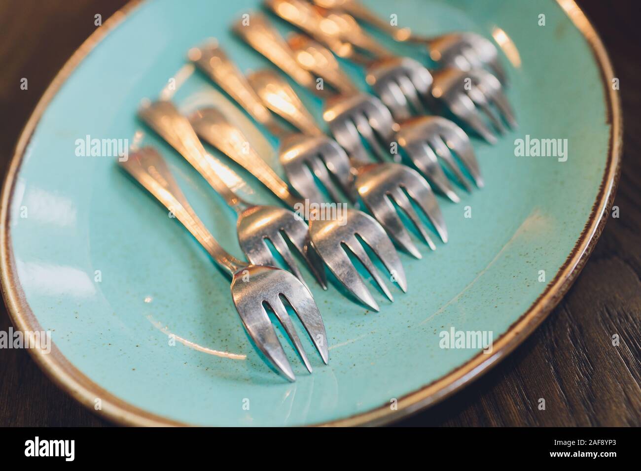 spoons, chopsticks, and plates set in buffet Stock Photo - Alamy