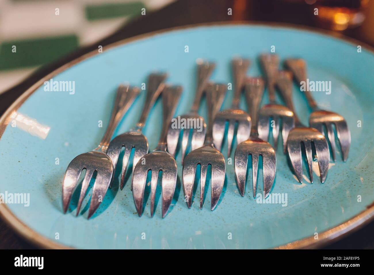 spoons, chopsticks, and plates set in buffet Stock Photo - Alamy