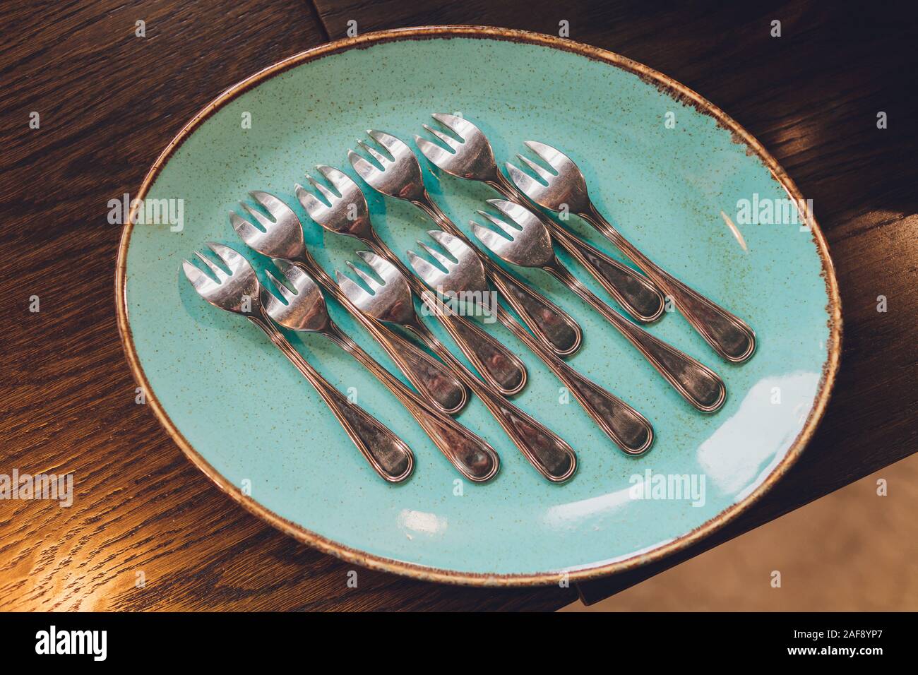 spoons, chopsticks, and plates set in buffet Stock Photo - Alamy