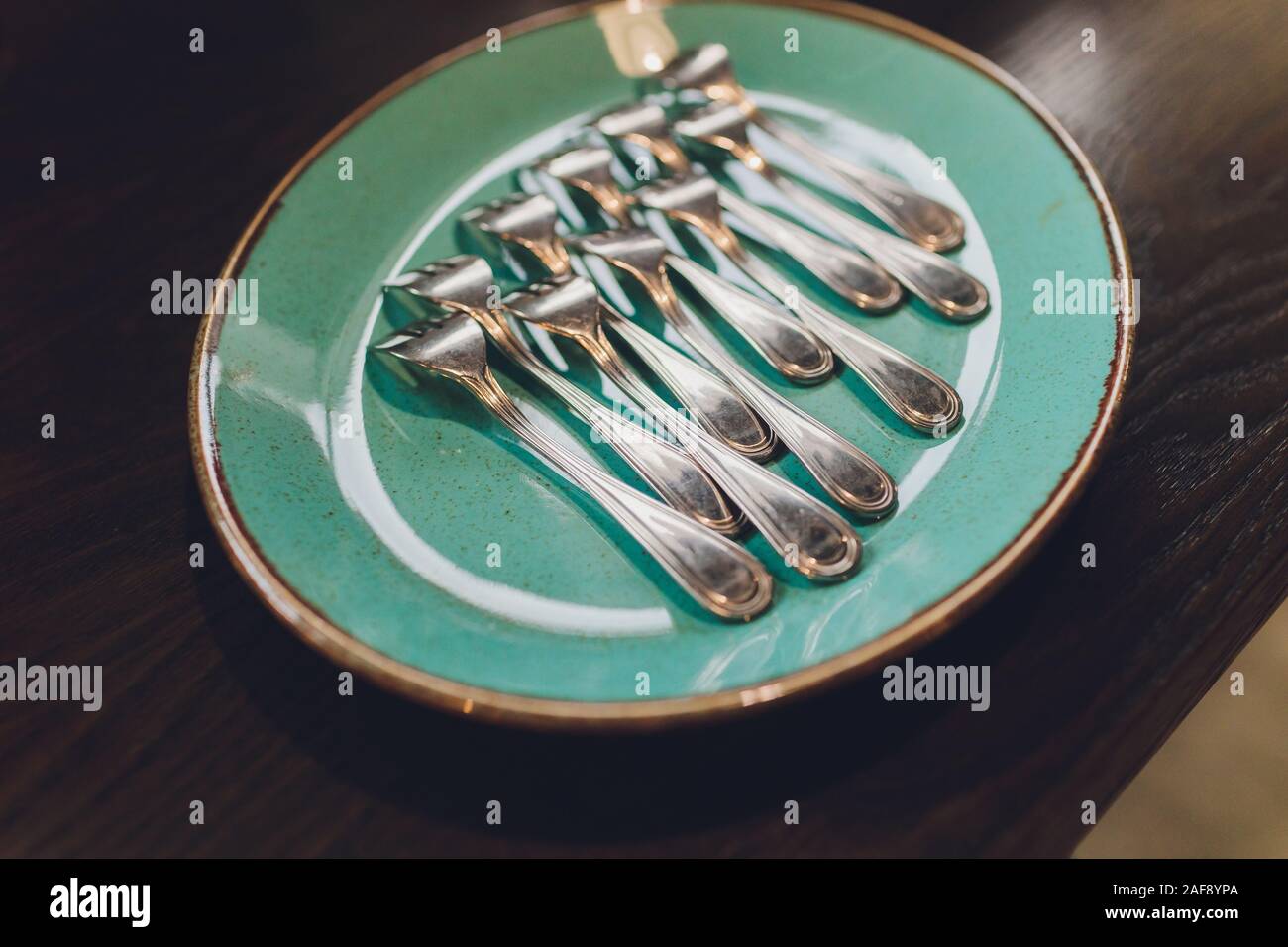 spoons, chopsticks, and plates set in buffet Stock Photo - Alamy