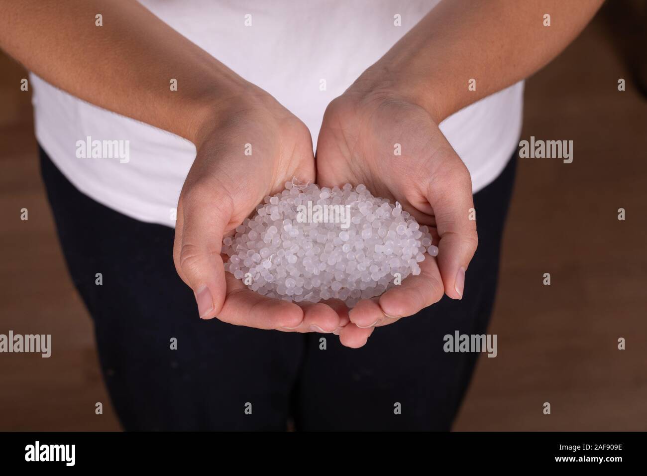 Small Plastic pellets on the finger.Micro plastic. air pollution Stock ...