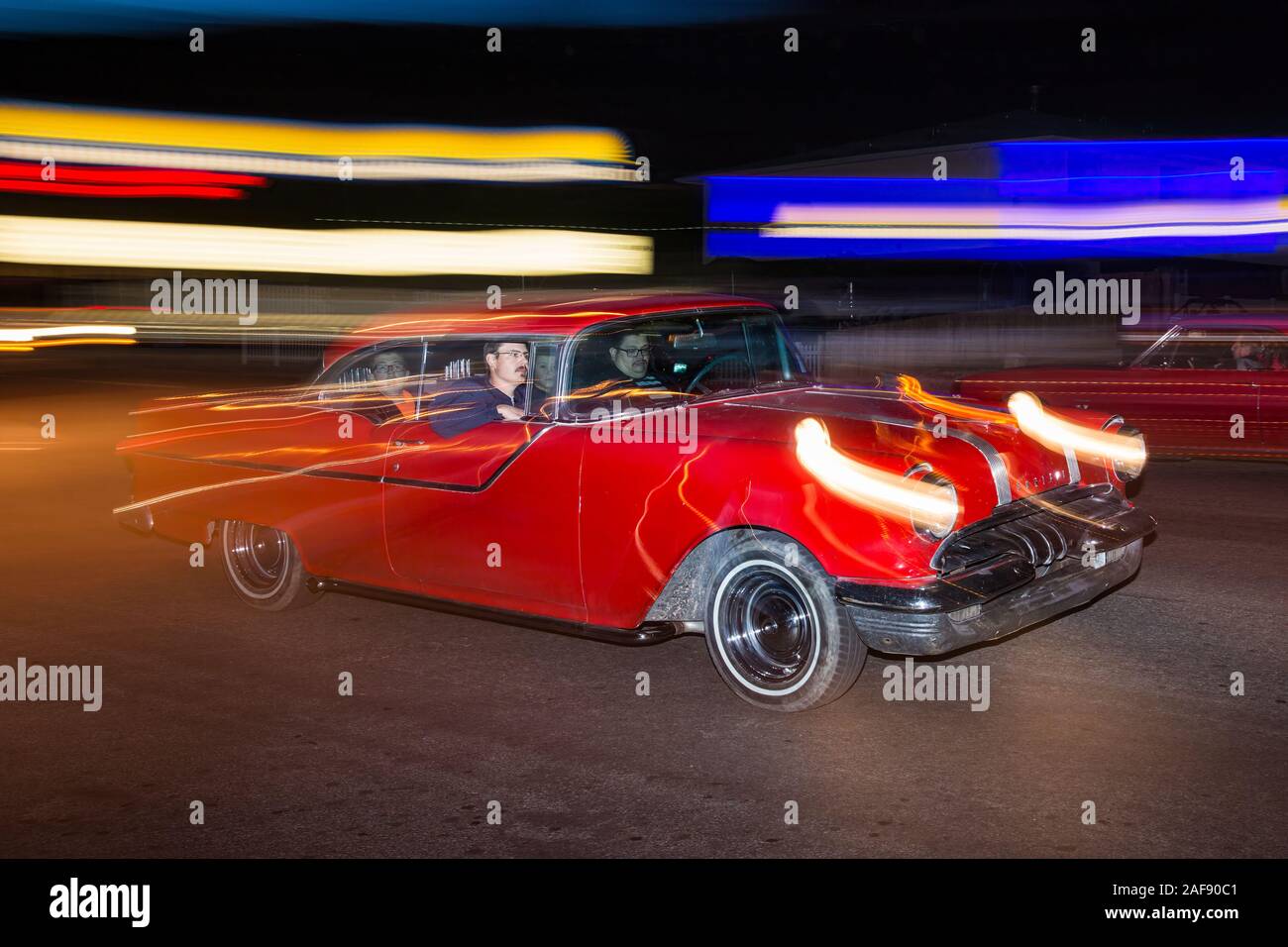 A restored 1955 Pontiac coupe cruising in the Moab April Action Car ...
