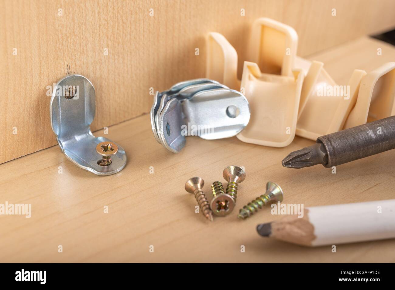 Mounting connectors installed to the chipboard. Carpentry work during ...