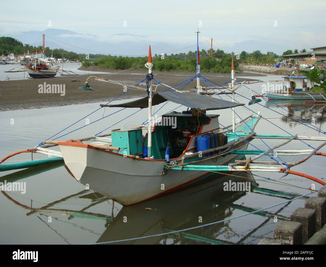 Bangkas (or bankas), traditional outrigger wooden boats used by the ...