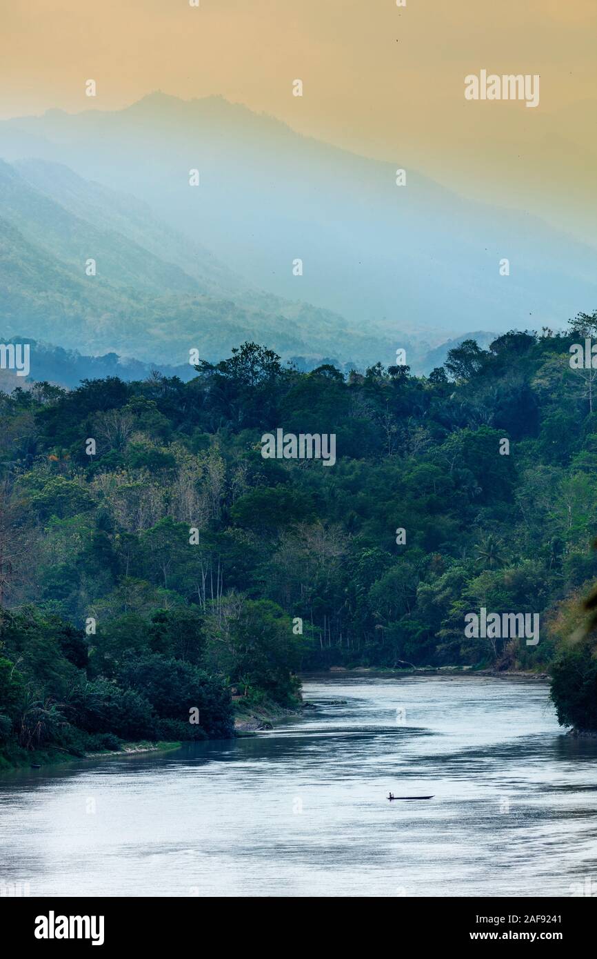 A wooden canoe crossing the Sadang River with the Rantekombola and ...