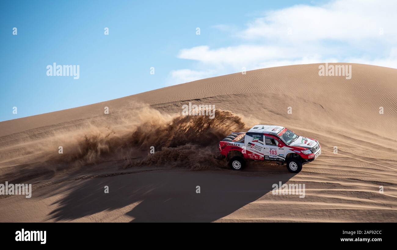 toyota hilux dakar rally edition splashing dust when climbing a sand ...