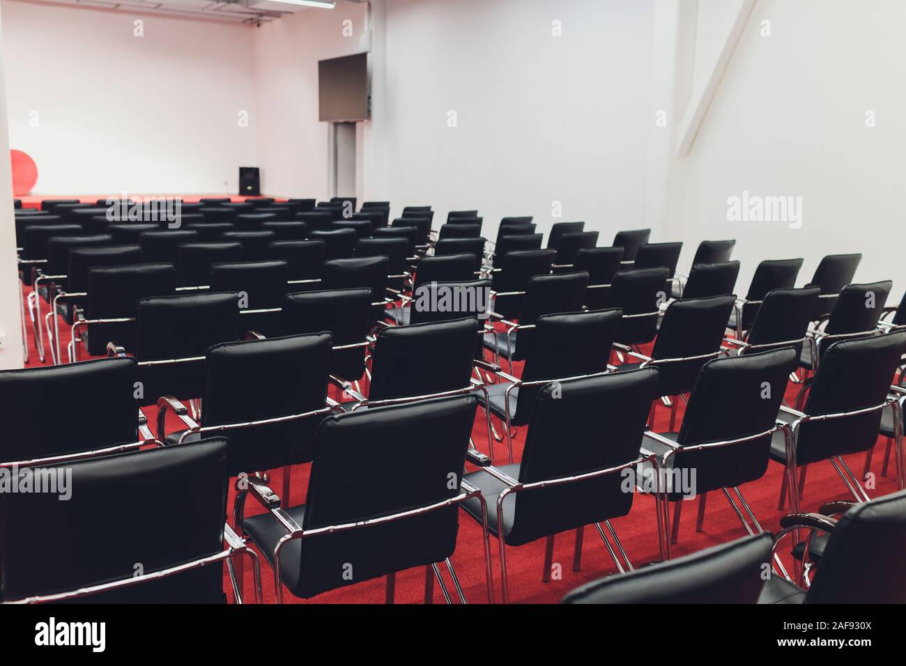 Black modern seats armchairs in conference room. Interior of conference ...