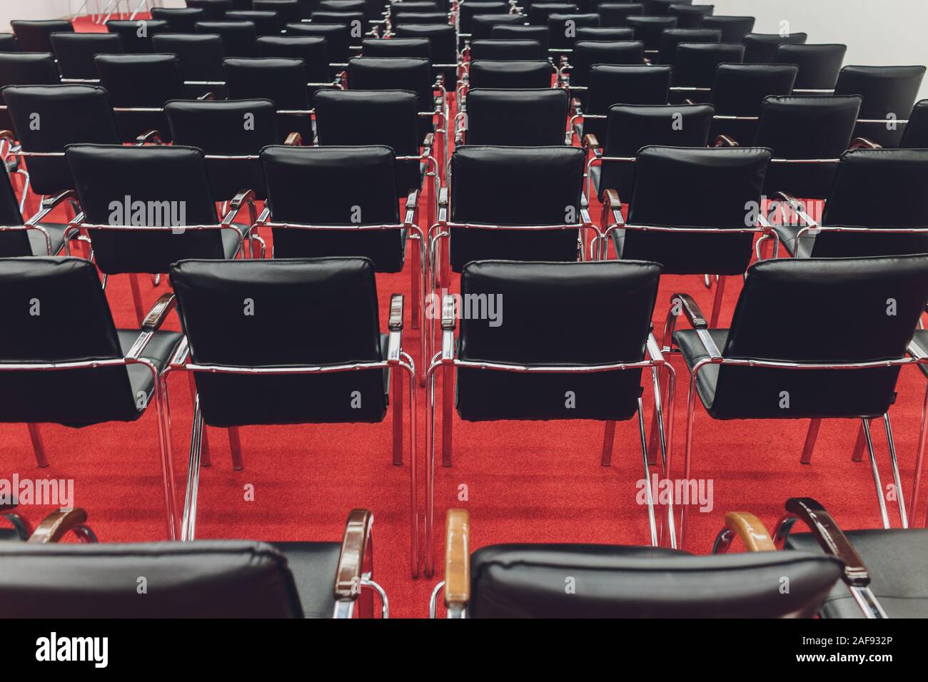 Black modern seats armchairs in conference room. Interior of conference ...
