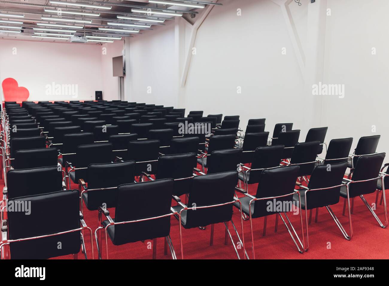 Black modern seats armchairs in conference room. Interior of conference ...
