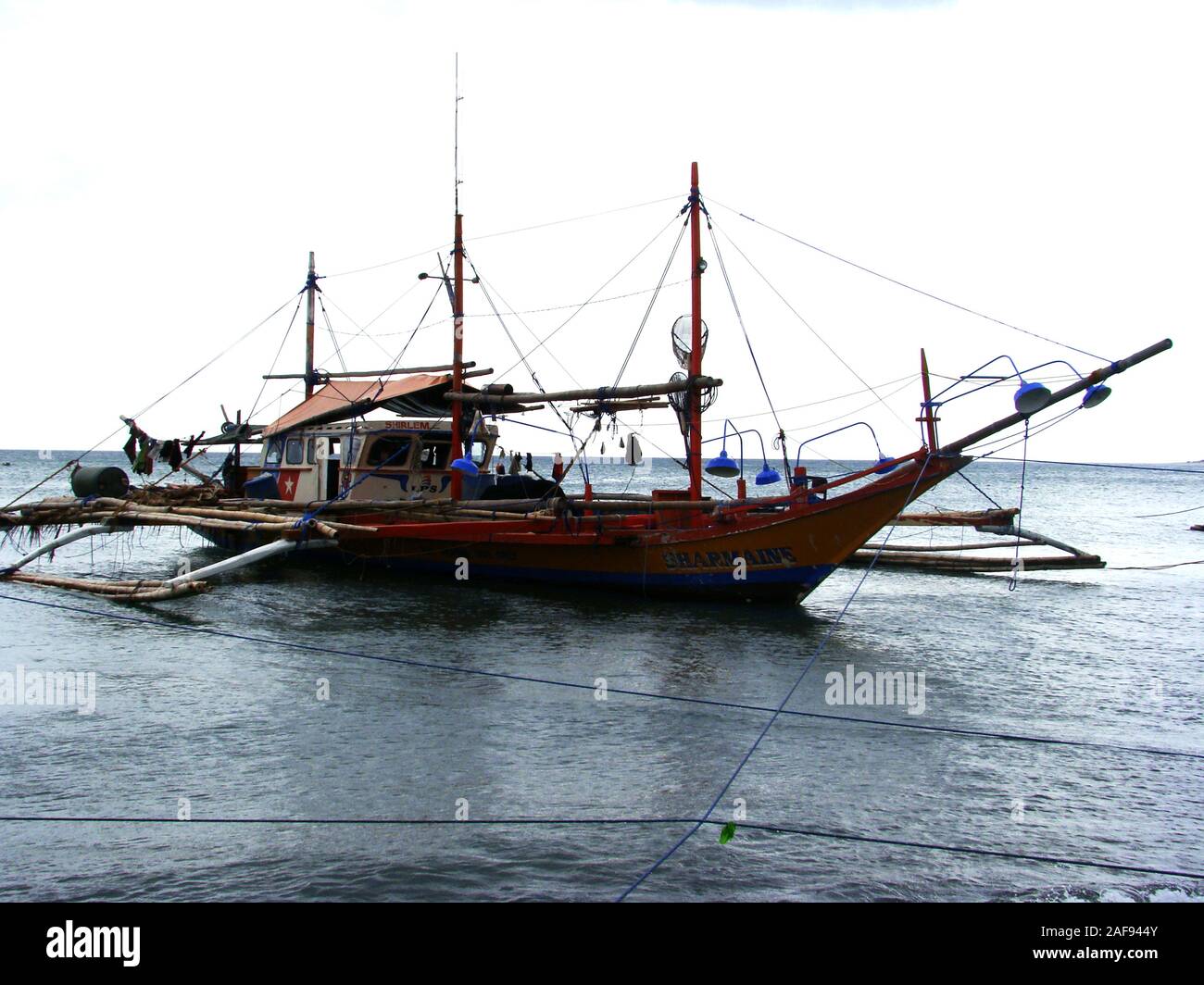 Bangkas (or bankas), traditional outrigger wooden boats used by the ...