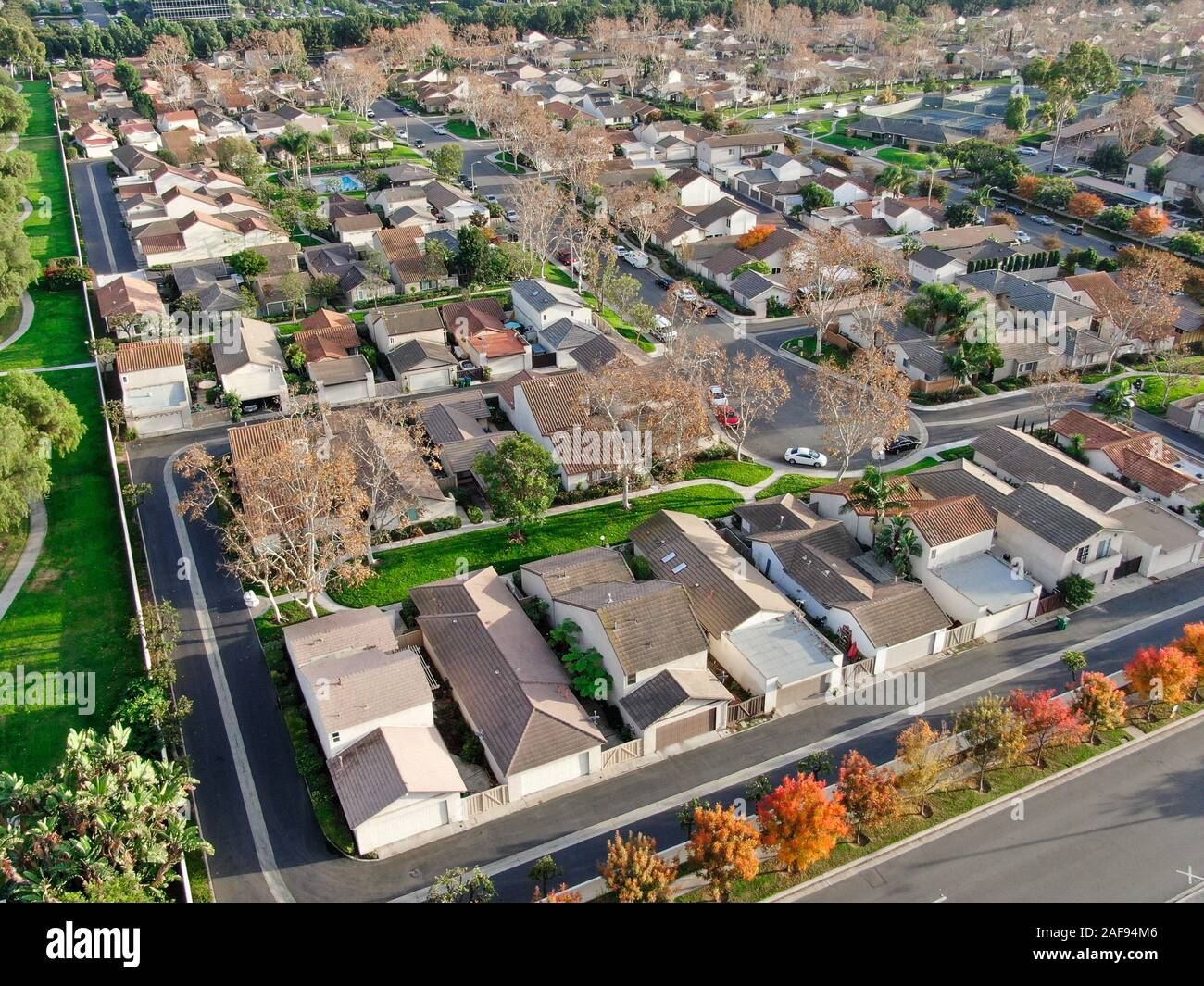 Aerial view of middle class suburban neighborhood with houses next to ...