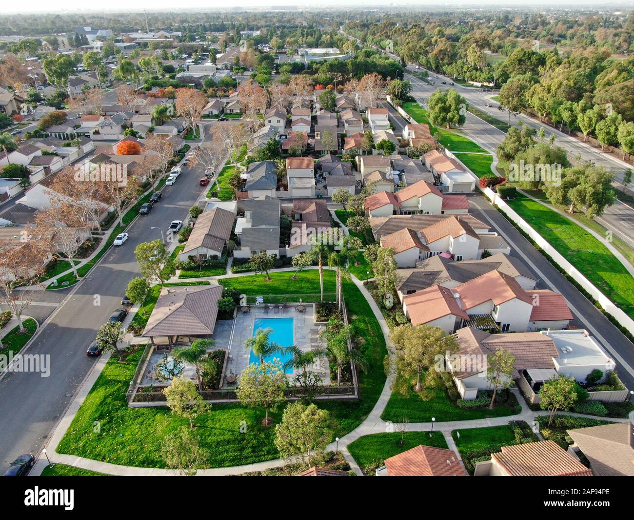 Aerial view of middle class suburban neighborhood with houses next to ...
