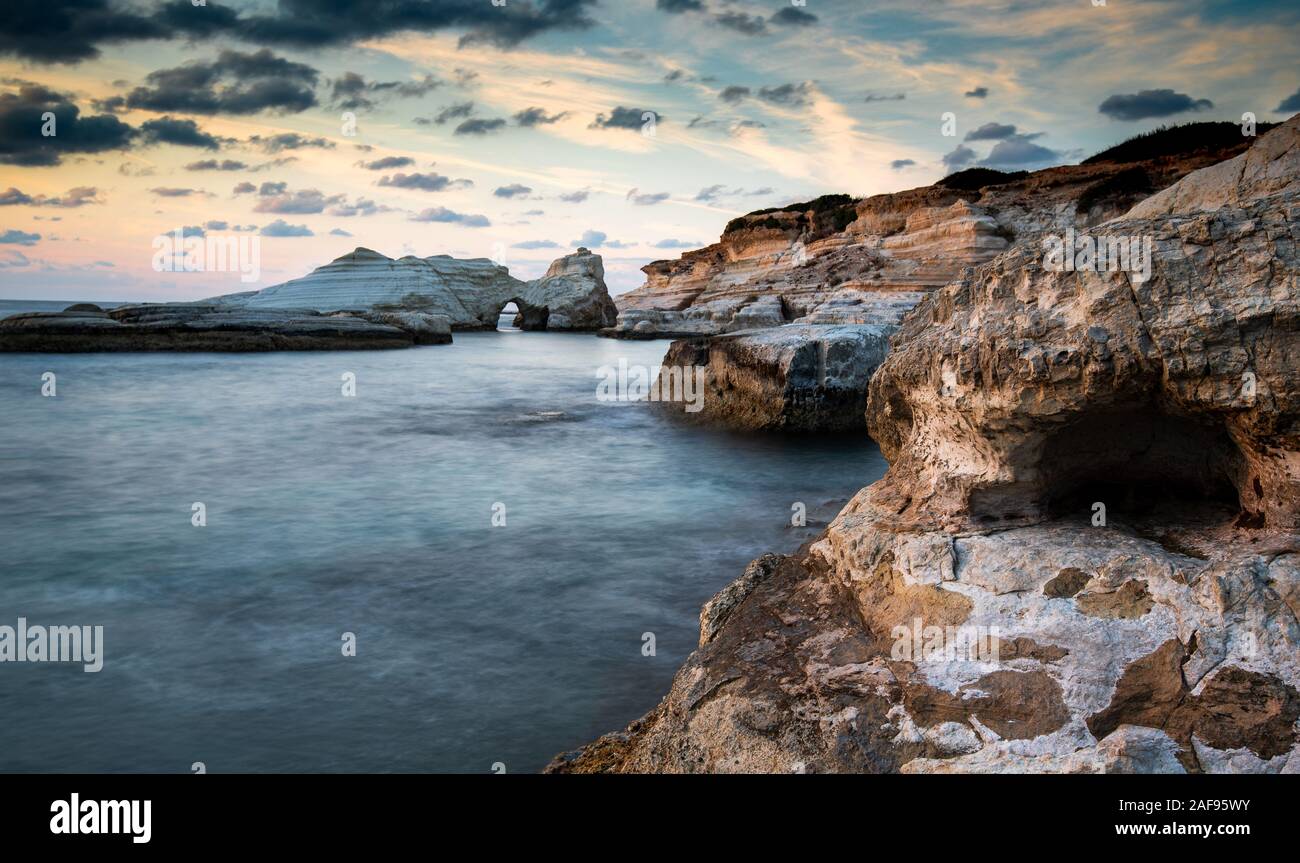 Rocky seashore seascape with wavy ocean and dramatic and beautiful ...