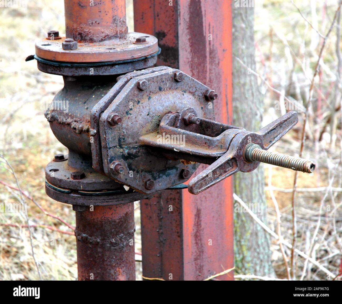 The old rusty water tap crane a latch Stock Photo - Alamy