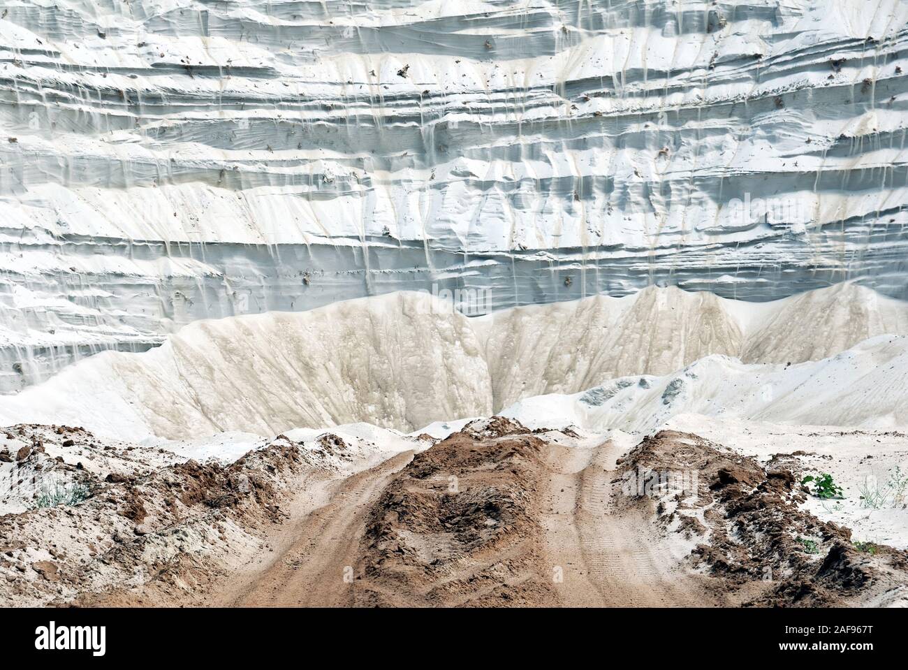 Slope of sandy mountain from white sand Stock Photo - Alamy