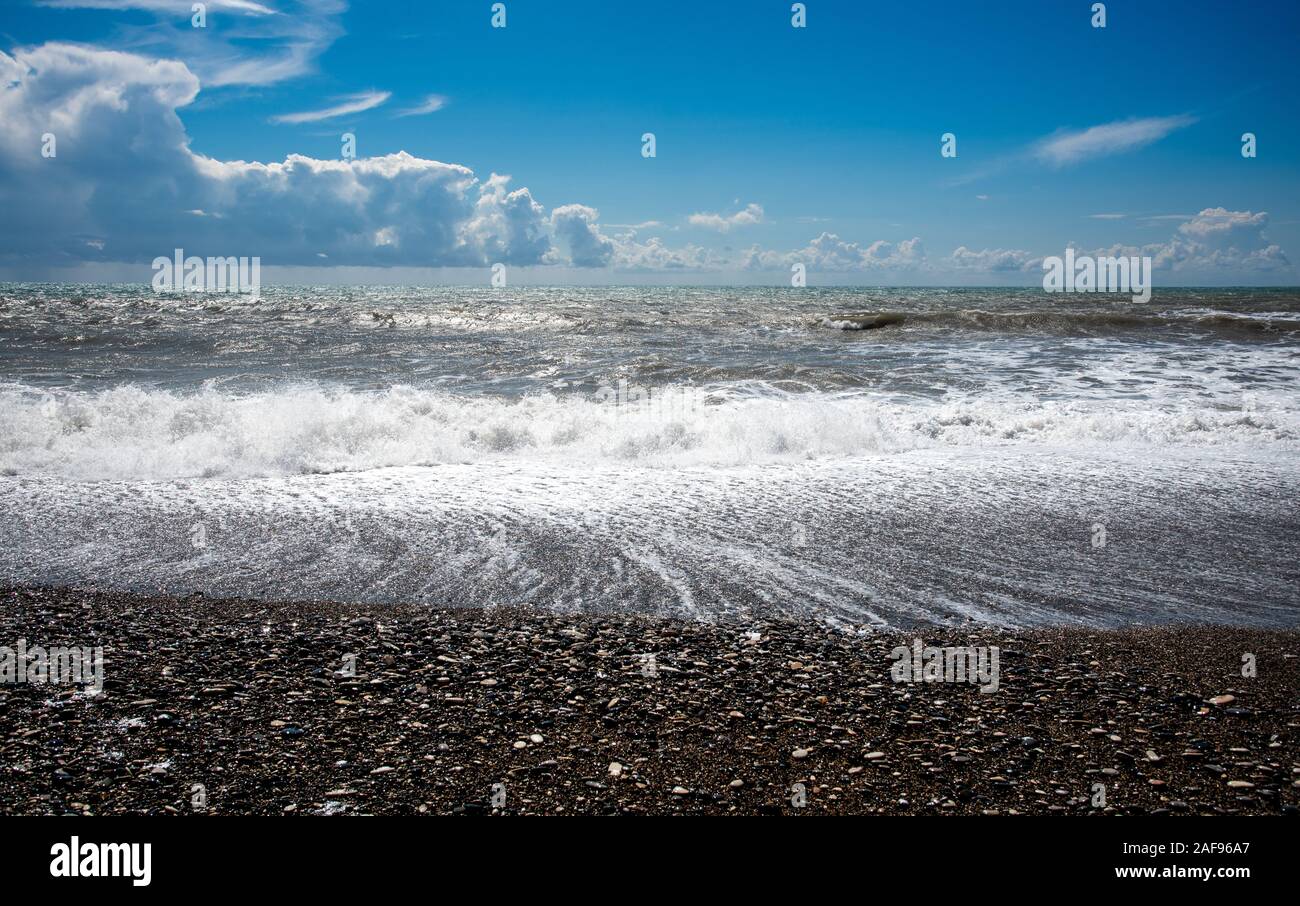 Stormy Sky and Wavy Ocean with waves hitting the seashore full with ...