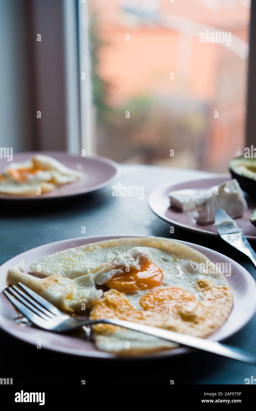 Vertical frame breakfast consisting of scrambled eggs for two persons ...