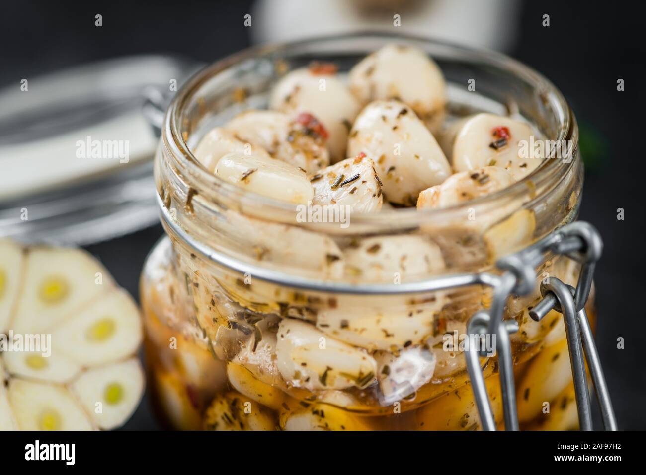 Fresh made Garlic (preserved) on a vintage background (close-up shot ...