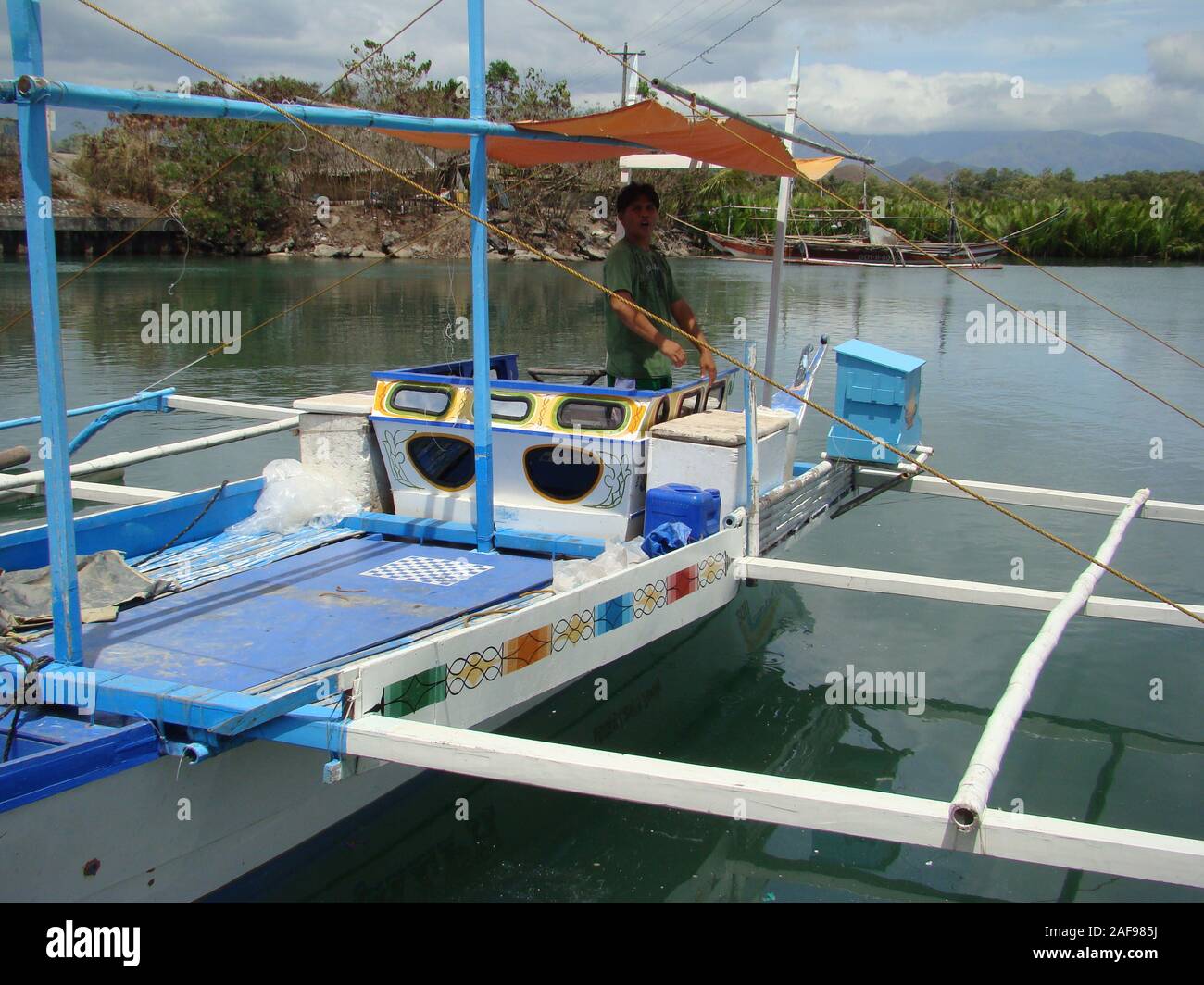 Bangkas (or bankas), traditional outrigger wooden boats used by the ...