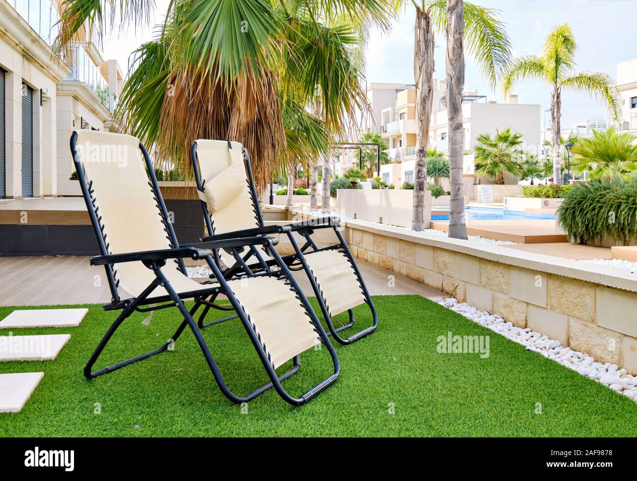 Cozy backyard pool lounge chair hi-res stock photography and images - Alamy