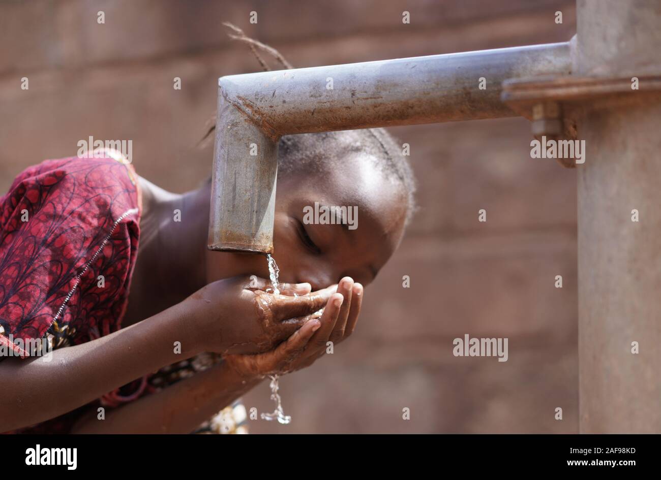 African Child Drinking Clean Water High Resolution Stock Photography ...