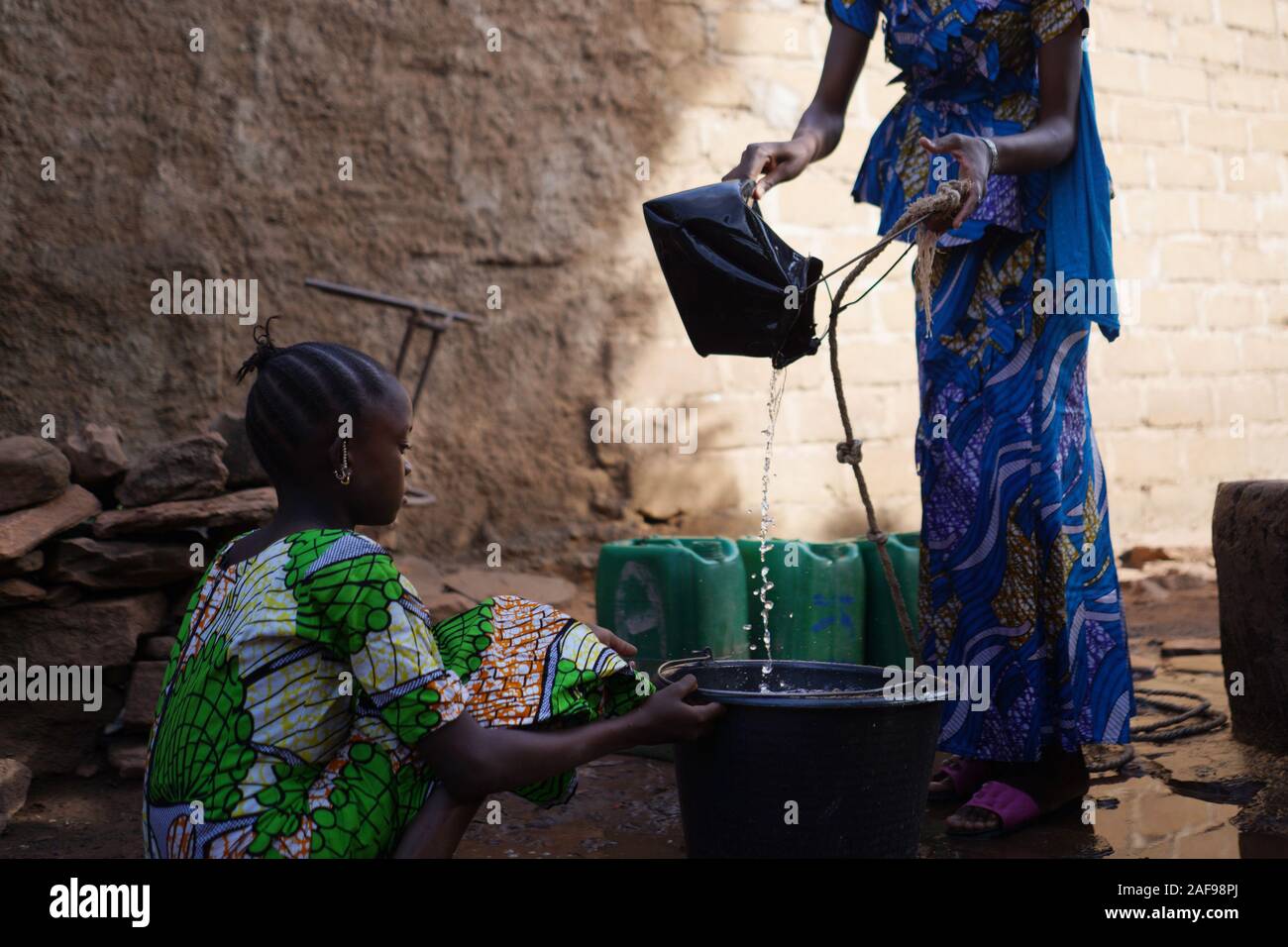 Children Collecting Water From Well Stock Photos & Children Collecting ...