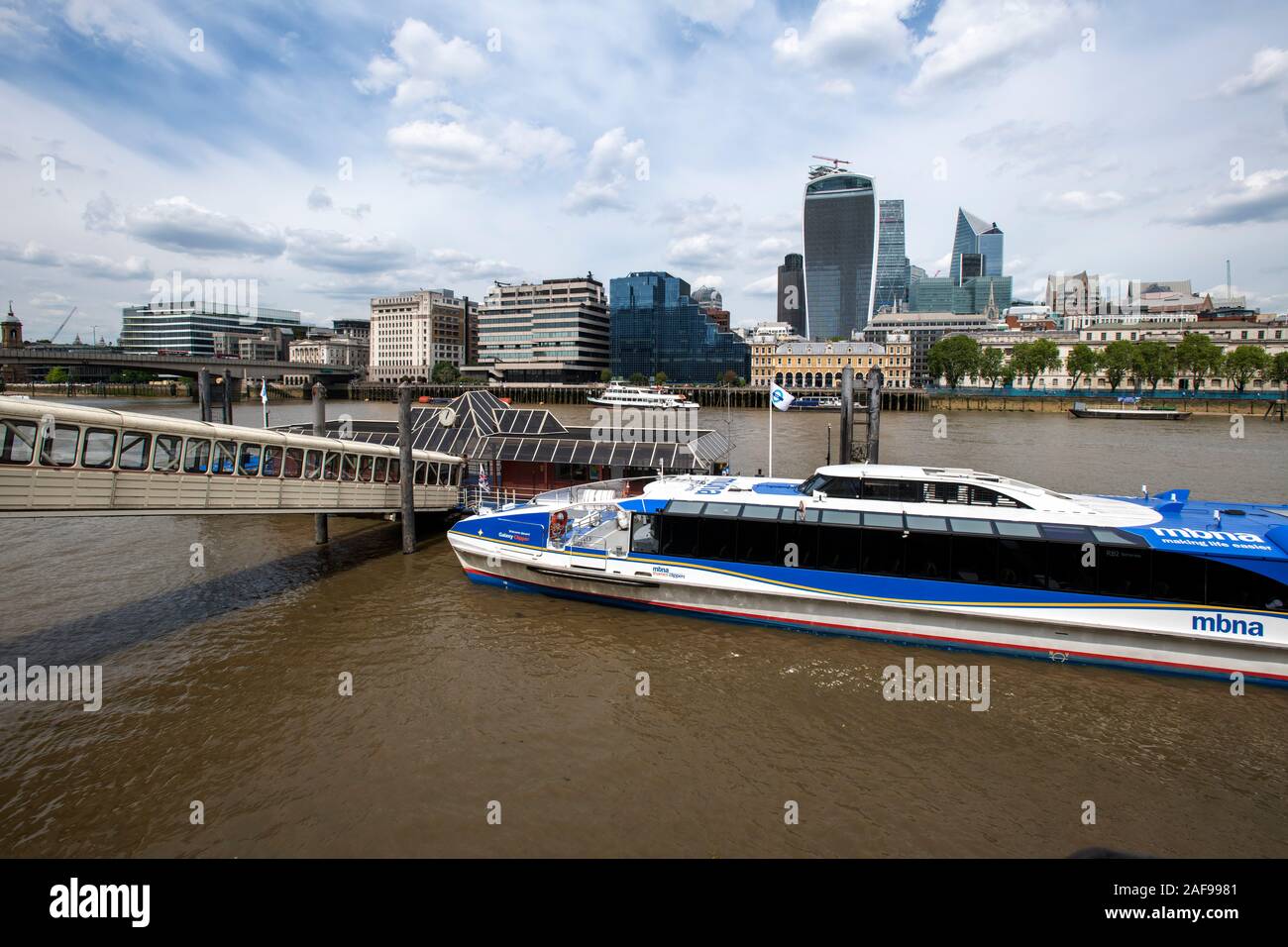 Water bus at pier London Bridge, London Stock Photo - Alamy
