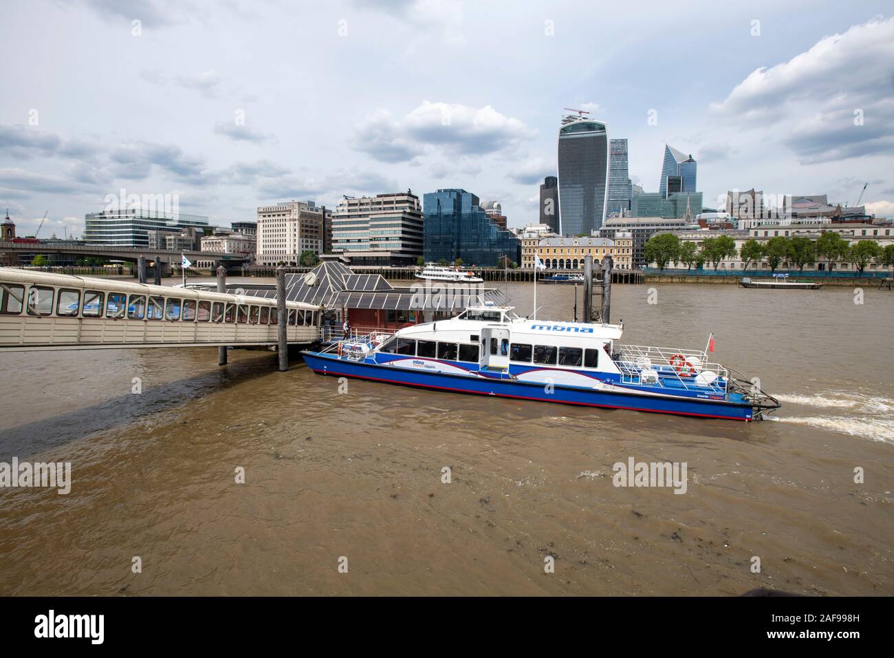Water bus at pier London Bridge, London Stock Photo - Alamy