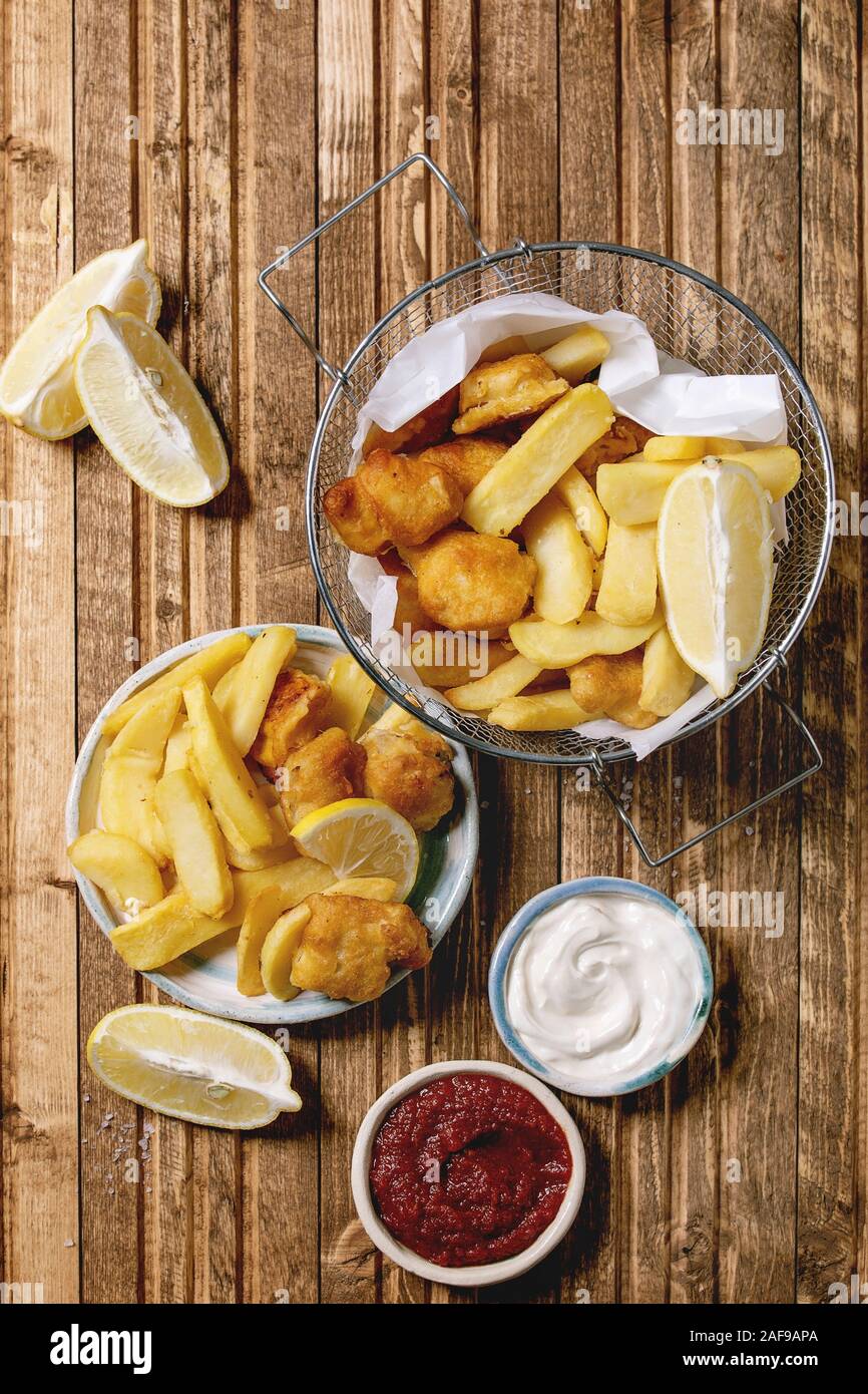 Classic british fast food fish and chips served in frying basket with ...