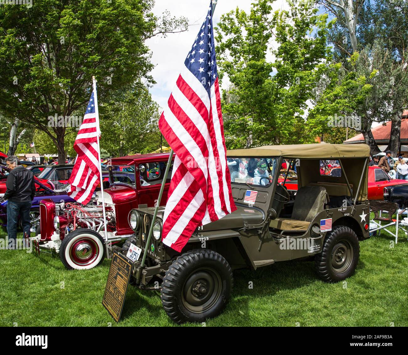 A restored stock 1951 Willys Jeep with American flags in the Moab April ...