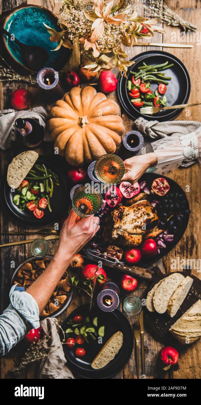Thanksgiving table setting. Flat-lay of couple celebrating holiday with ...